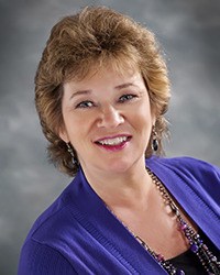 Backus touts her credentials, experience and long community involvement ...