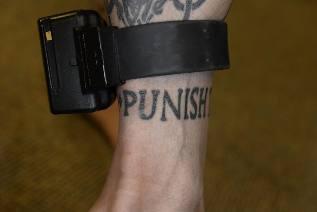 Judge releases unredacted photos of Auburn cop’s tattoos | Auburn Reporter